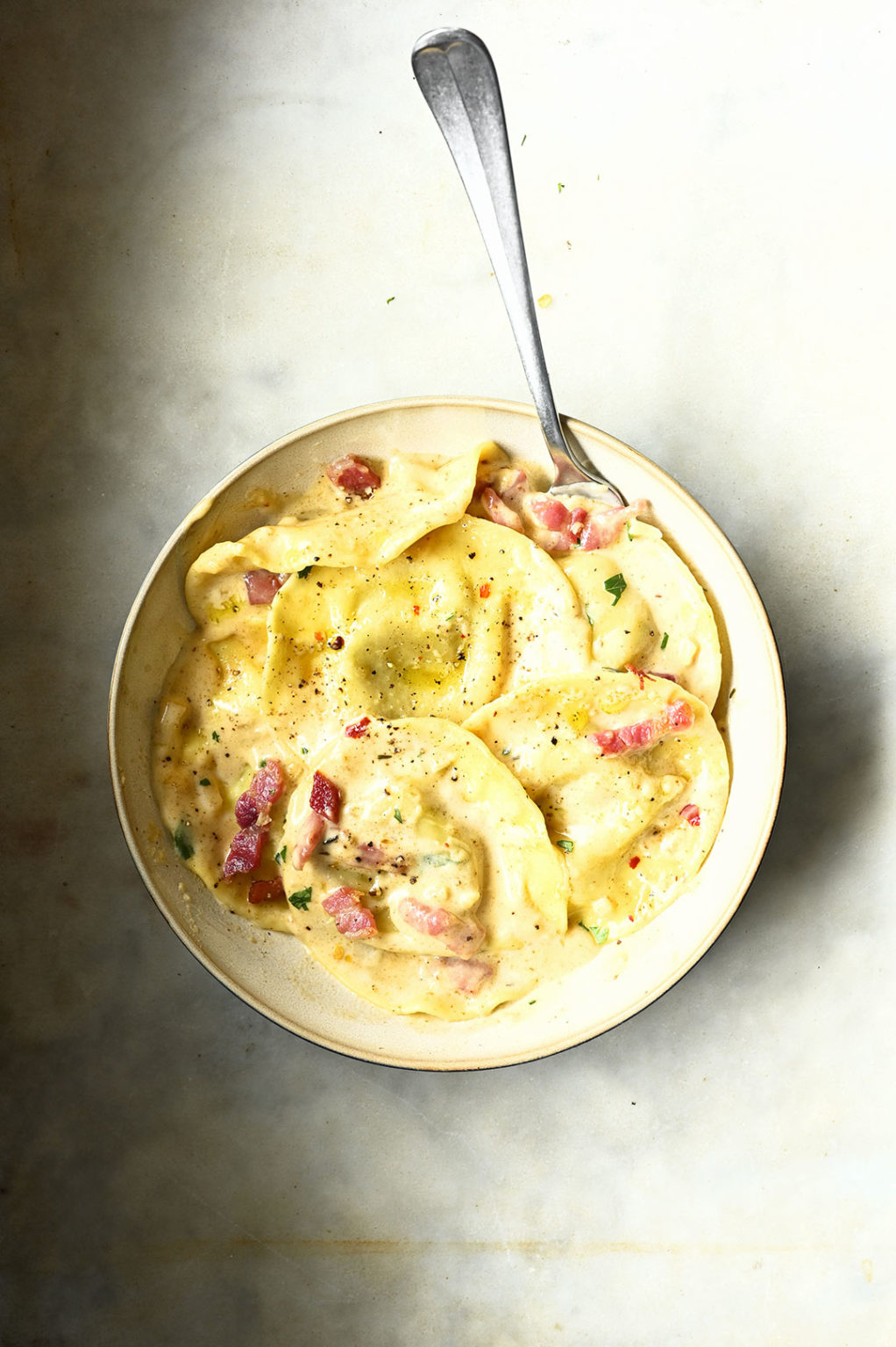 Ravioli in Creamy Bacon Sauce - Serving Dumplings