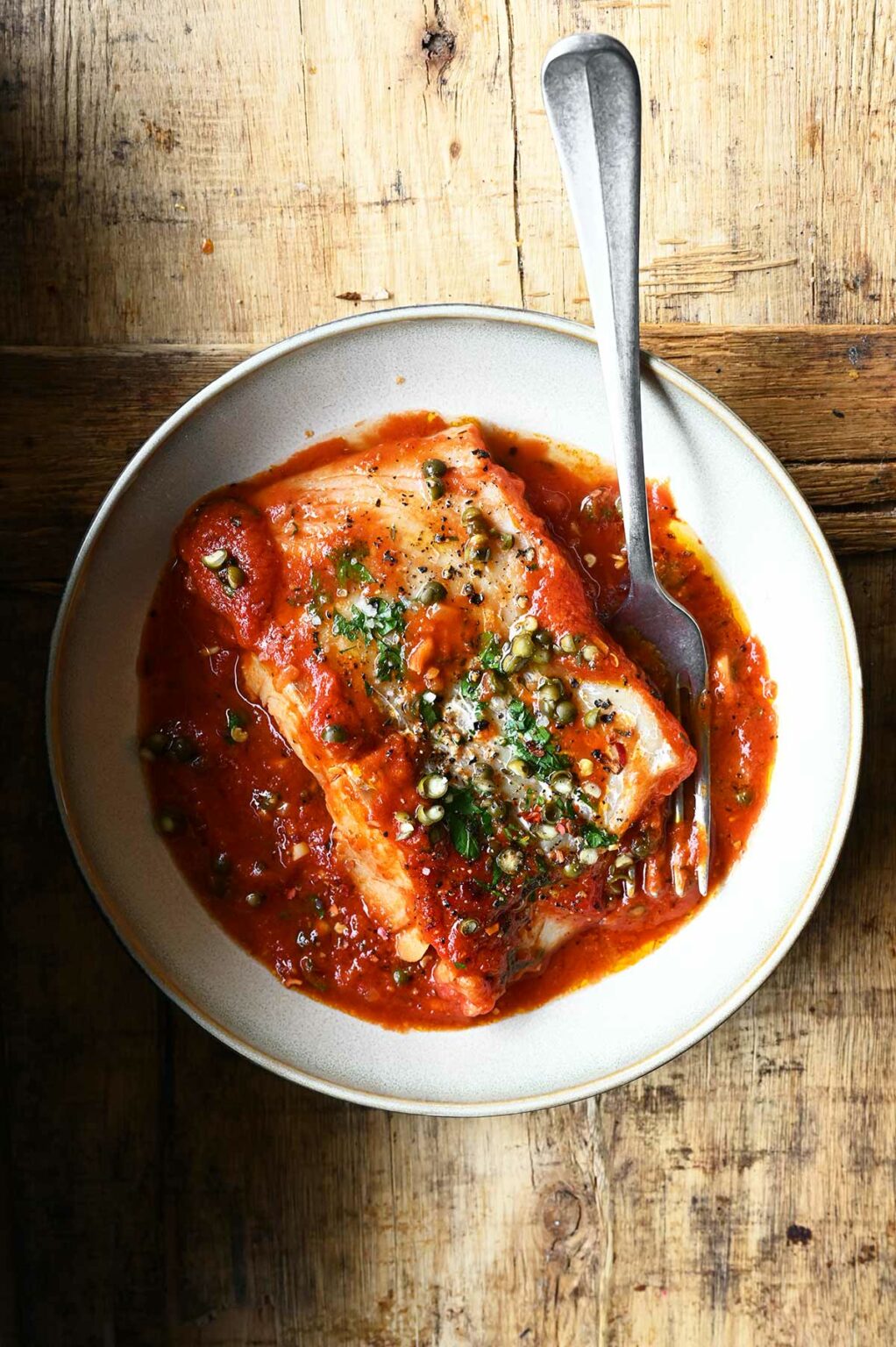 Poached Cod in Peppery Tomato Sauce - Serving Dumplings