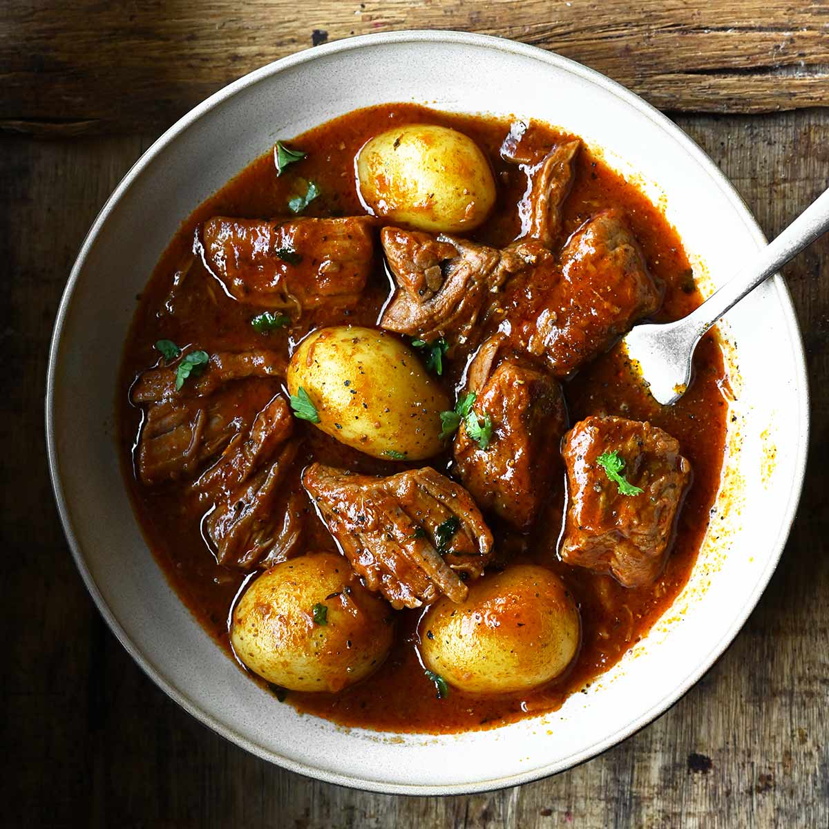 Hearty Beef and Potato Stew - Serving Dumplings